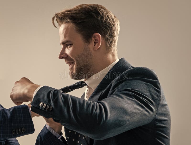 Punch Given in Response. Professional Man Punch Being Pulled by Necktie ...