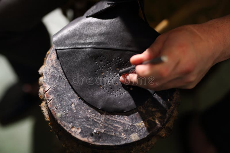 Punch leather for shoes stock image. Image of class, bone - 58812983