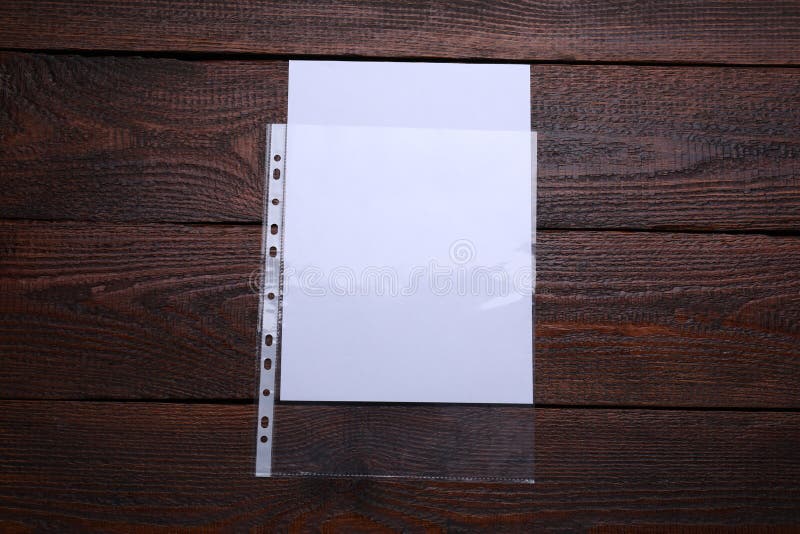 Punched Pocket with Paper Sheet on Wooden Table, Top View Stock Photo ...
