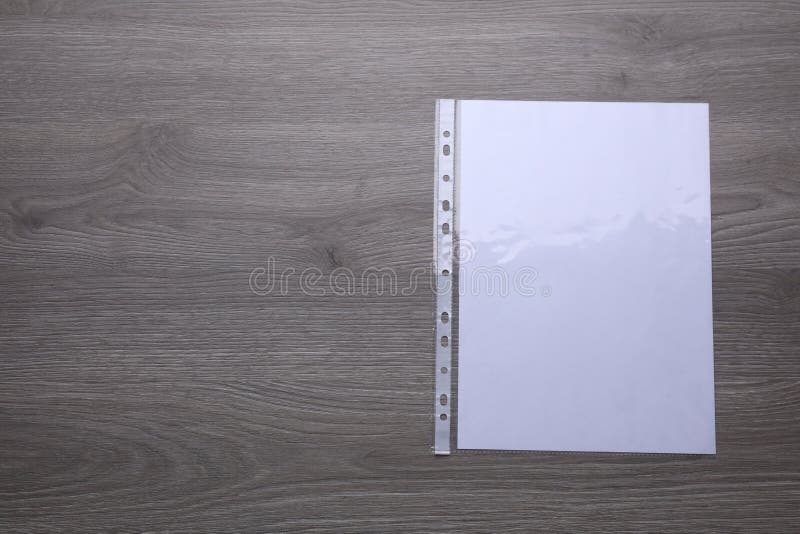 Punched Pocket with Paper Sheet on Wooden Table, Top View. Space for ...