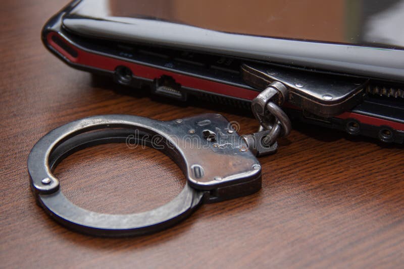 Punishment for Cybercrime, Handcuffs and Laptop, Password Cracking ...