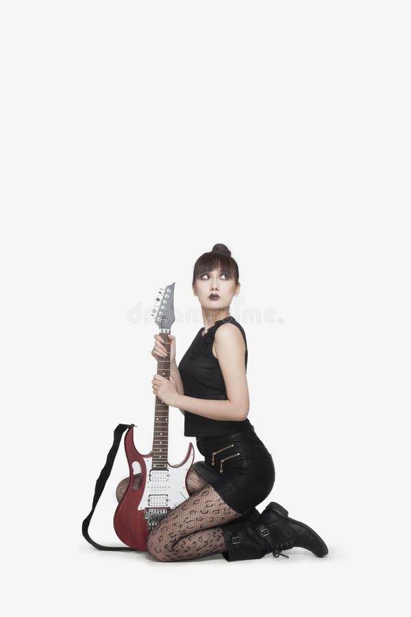 Punk Rocker Kneeling with Guitar Stock Photo - Image of hipster, city ...