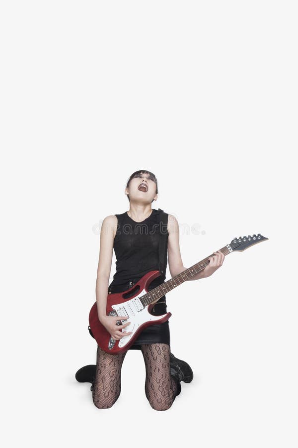 Punk Rocker Kneeling with Guitar Stock Image - Image of artist ...