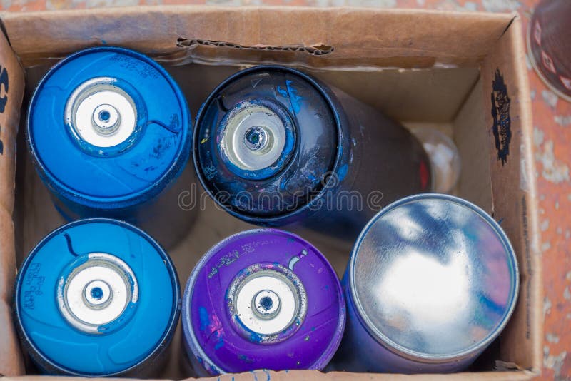 PUNTA DEL ESTE, URUGUAY - MAY 06, 2016: Empty Spray Cans Inside a Box ...