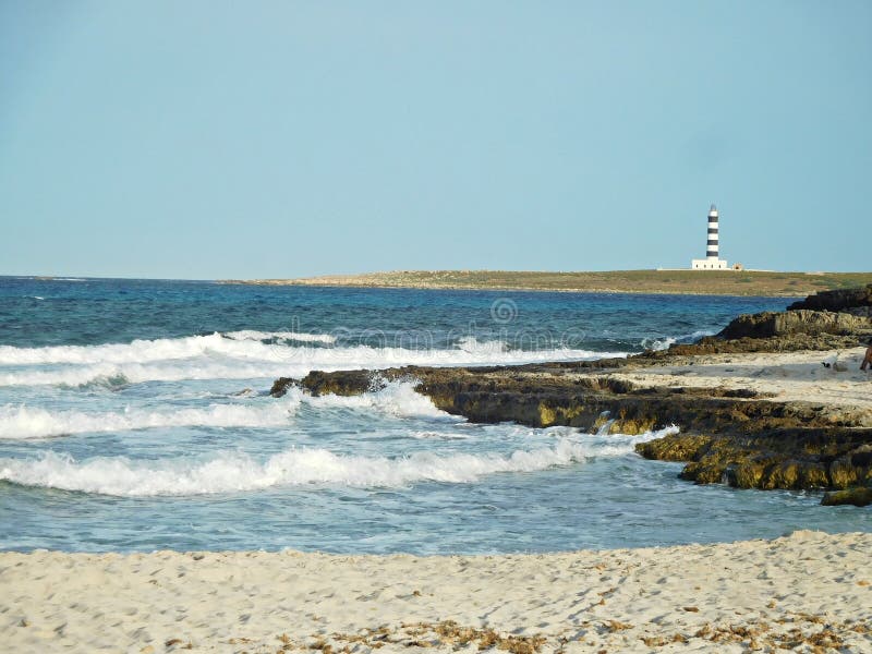 Punta Prima Beach and Lighthouse, Menorca Stock Photo - Image of ...