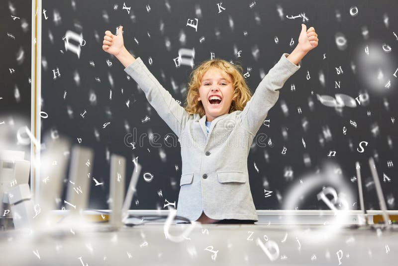 Pupil in Elementary School Cheers in Front of Blackboard Stock Photo ...