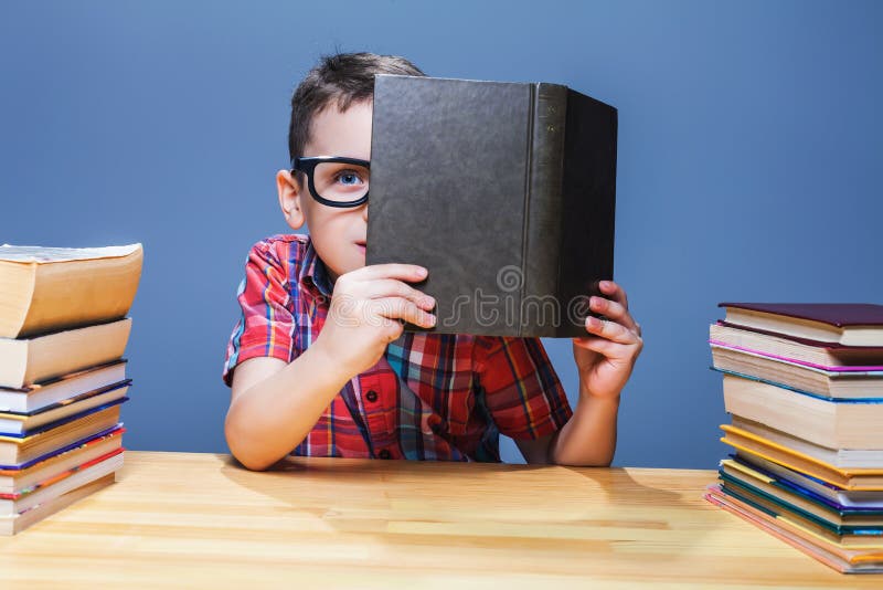 Pupil in Glasses Getting Knowledge from a Textbook Stock Image - Image ...