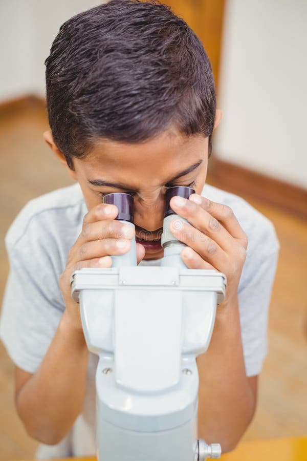 Pupil Looking through Microscope in Class Stock Photo - Image of ...