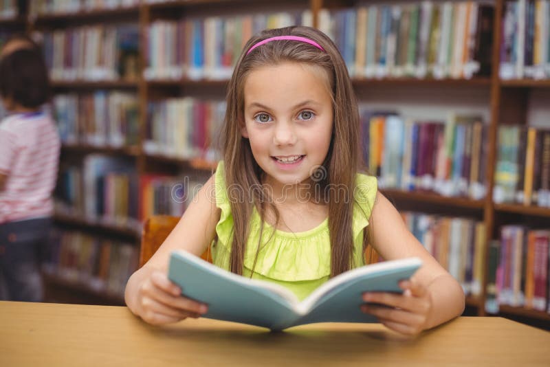 Pupil Reading Book at Desk in Library Stock Image - Image of cute ...