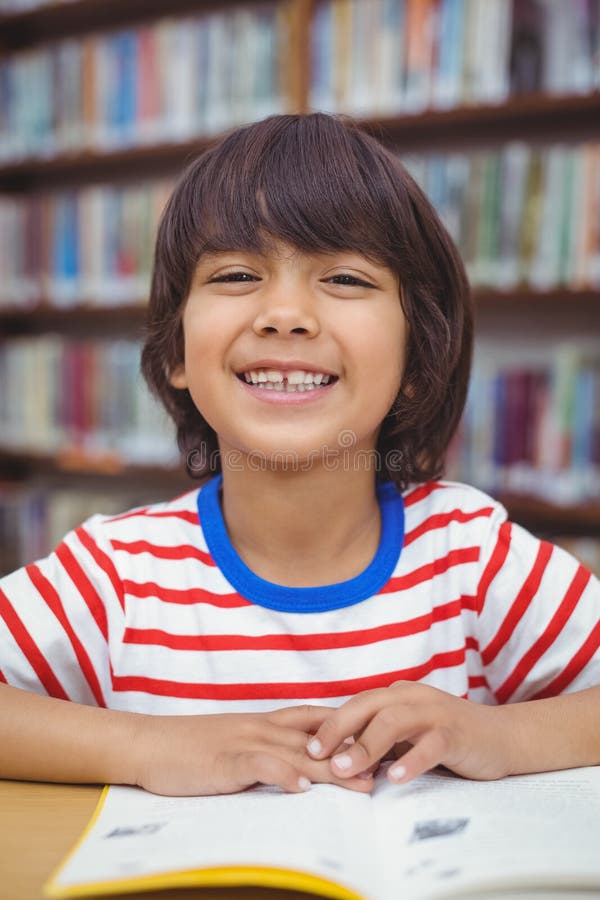 Pupil Reading Book at Desk in Library Stock Image - Image of ...