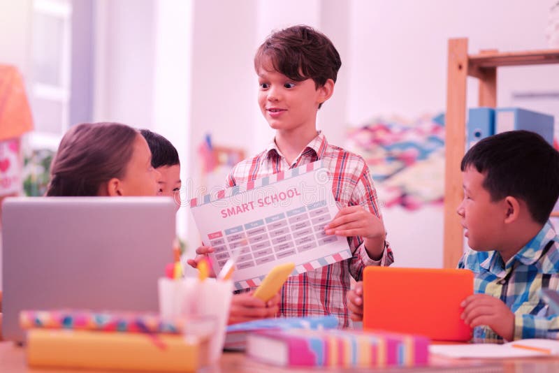 Pupil of a Smart School Holding His Timetable. Stock Photo - Image of ...