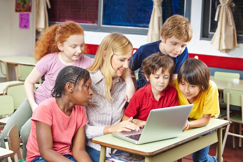 Pupil and Teacher with Laptop on the Internet Stock Photo - Image of ...