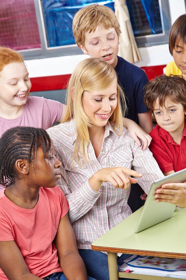 Teacher Using Tablet in Computer Science Class Stock Photo - Image of ...