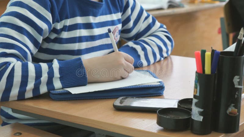 Pupil Writes the Text in the Notebook Indoors Stock Footage - Video of ...
