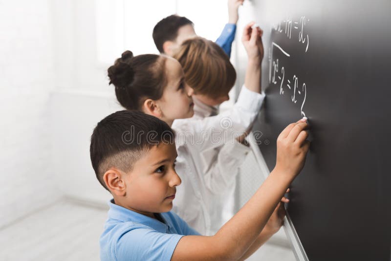 Pupil Writing Maths Equations on the Board Stock Image - Image of ...