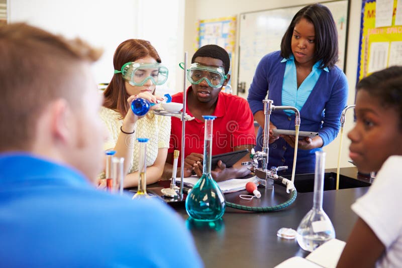 Pupils Carrying Out Experiment in Science Class Stock Image - Image of ...