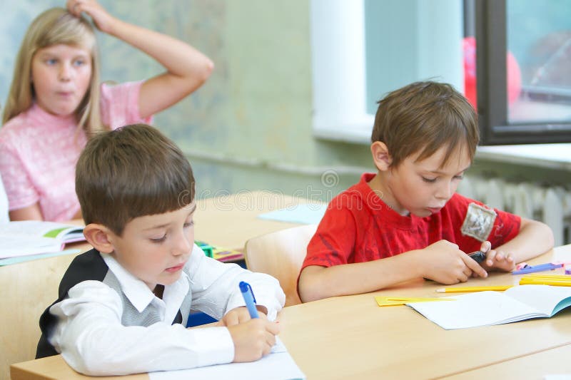 Pupils in a class stock photo. Image of school, desk, book - 4462950