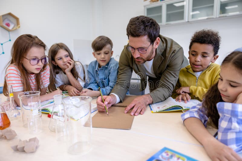 Pupils Doing Science with Teacher in Classroom. Stock Photo - Image of ...