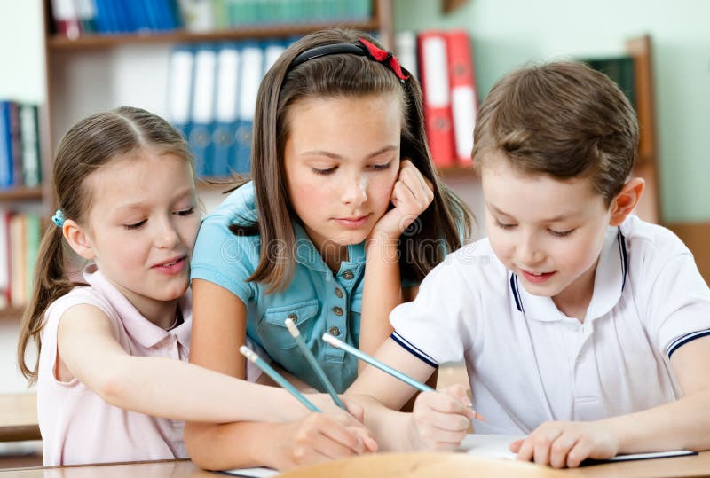 Classmates Help To Each Other To Find Something Stock Image - Image of ...
