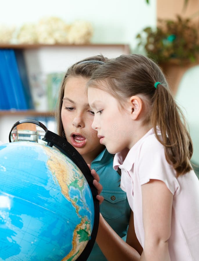 Pupils Look at the Globe in Wide-eyed Astonishment Stock Photo - Image ...