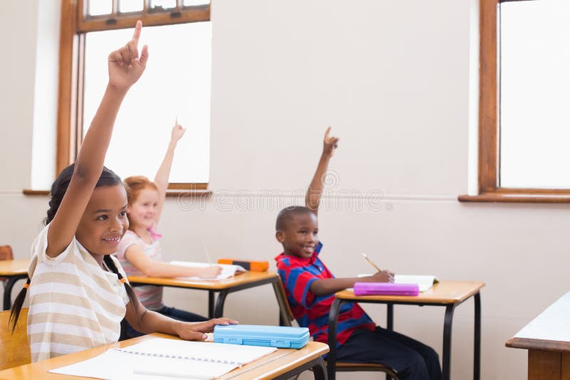 Pupils Raising Their Hands during Class Stock Photo - Image of class ...