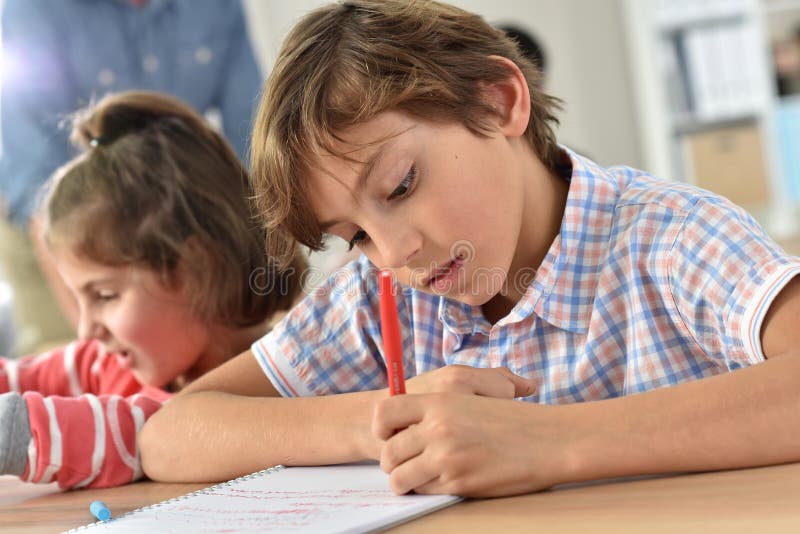 Pupils at School Writing in Notebooks Stock Photo - Image of writing ...
