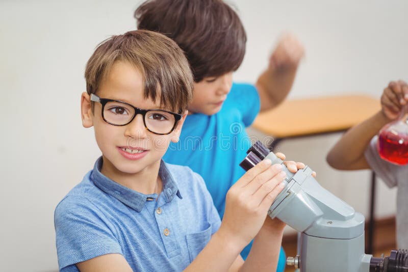 Pupils at Science Lesson in Classroom Stock Image - Image of holding ...