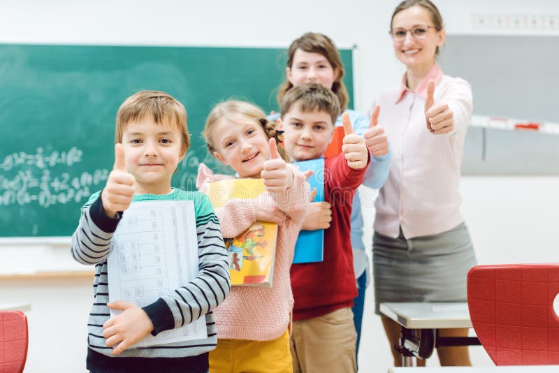 Pupils and Teacher Showing Thumbs-up in School Having Fun Stock Image ...