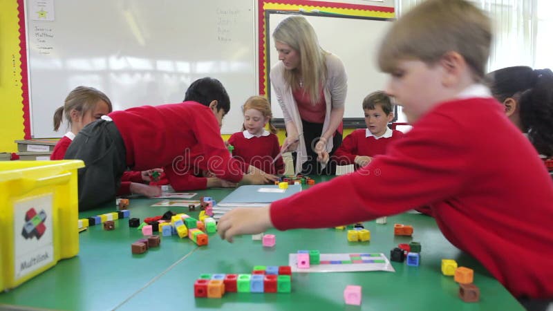 Pupils and Teacher Working with Coloured Blocks Stock Footage - Video ...