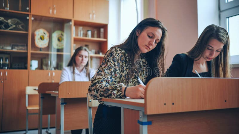Pupils of the 11th Grade in the Class at the Desks during the Lesson ...
