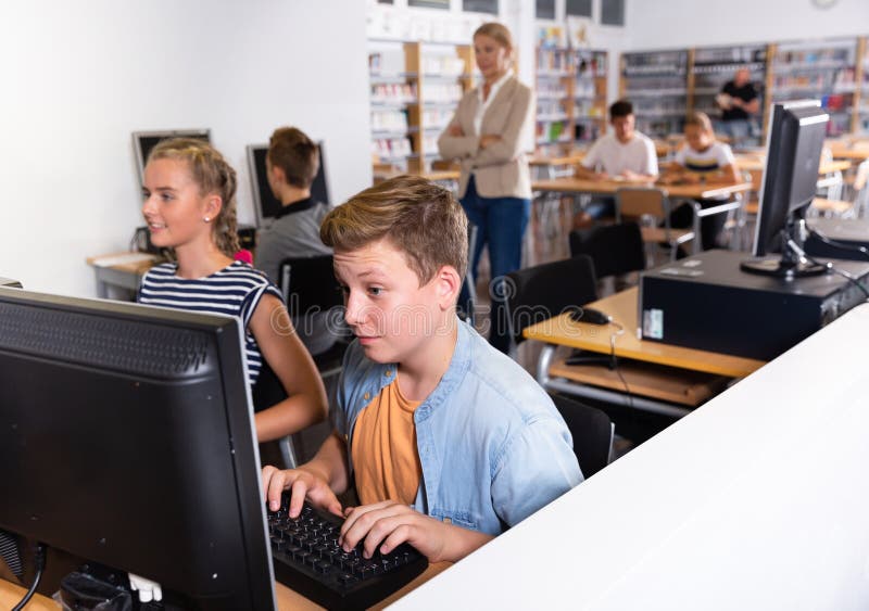 Pupils Using Computers at Lesson, Teacher Teaching Them Stock Image ... Pupils Using Computers at Lesson, Teacher Teaching Them Stock Image ...