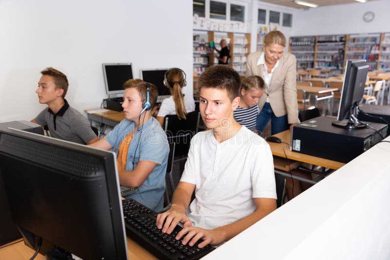 Pupils Using Computers at Lesson, Teacher Teaching Them Stock Image ... Pupils Using Computers at Lesson, Teacher Teaching Them Stock Image ...