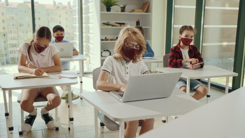 Pupils Using the Computers and Tablets Sitting in the Class during ...