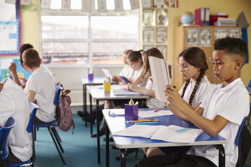 Class of Primary School Kids Studying in a Classroom Stock Photo ...