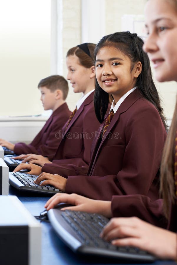Pupils Wearing School Uniform in Computer Class Stock Image - Image of ...