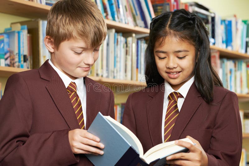 Girl Wearing School Uniform Reading Book Library Stock Photos - Free ...