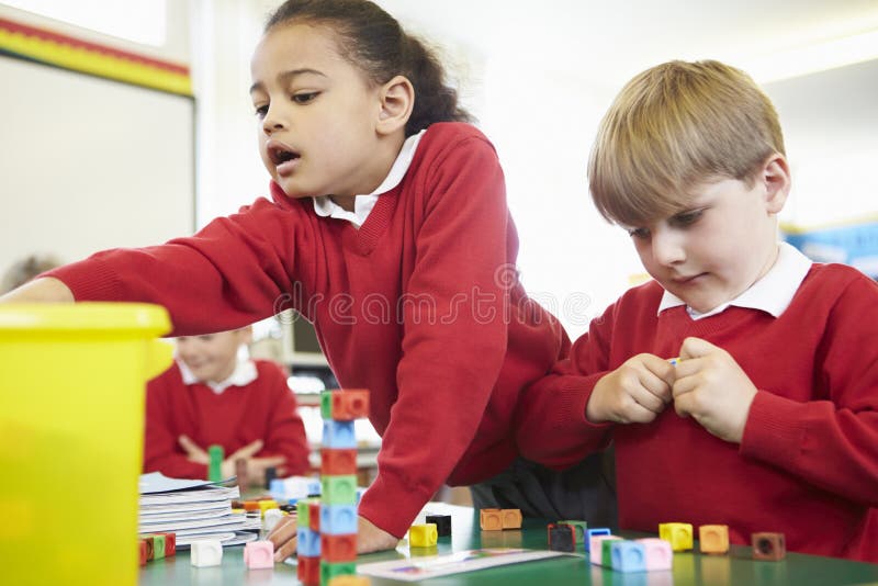 Pupils Working with Coloured Blocks in Maths Lesson Stock Image - Image ...