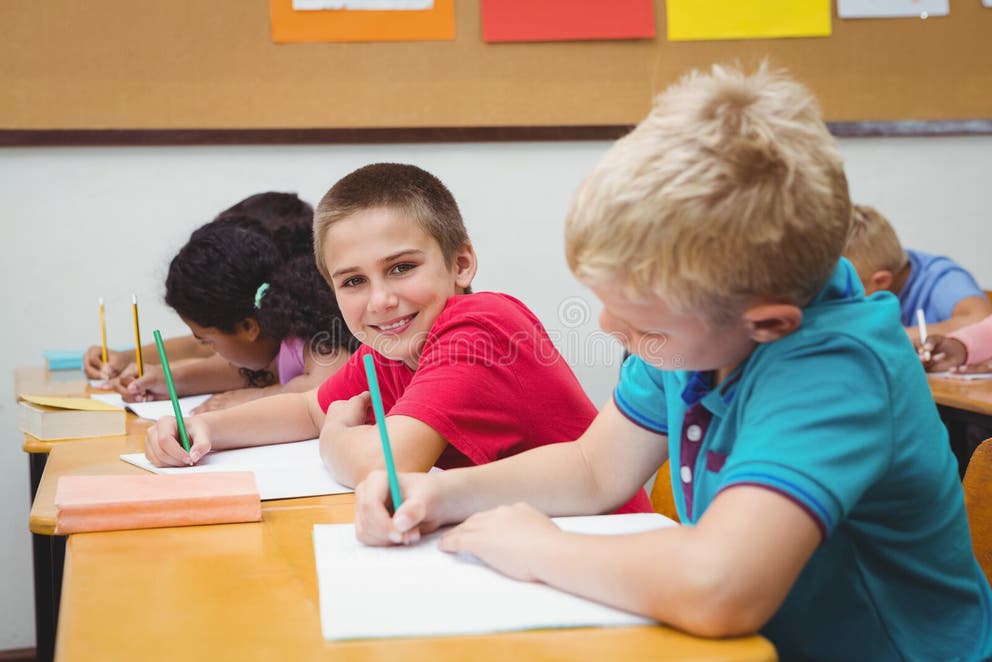 Pupils Working at School Work Stock Image - Image of mixedrace ...