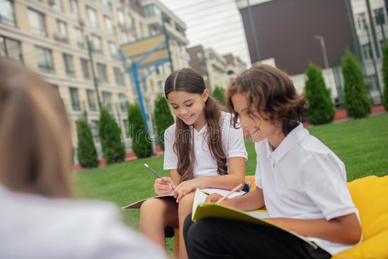 Pupils Working Together on a Project and Looking Excited Stock Photo ...