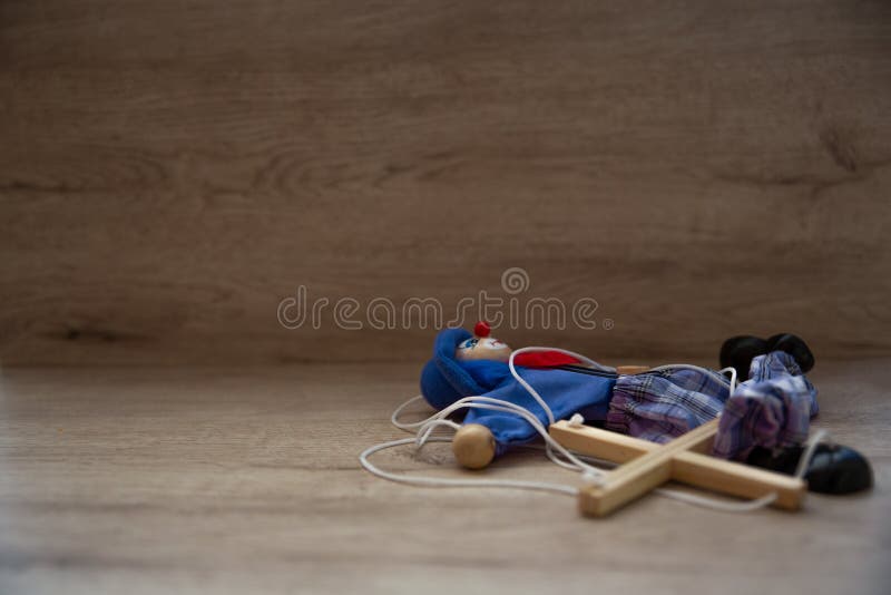 A Puppet-clown, Entangled in Threads and Lying Limp Stock Photo - Image ...