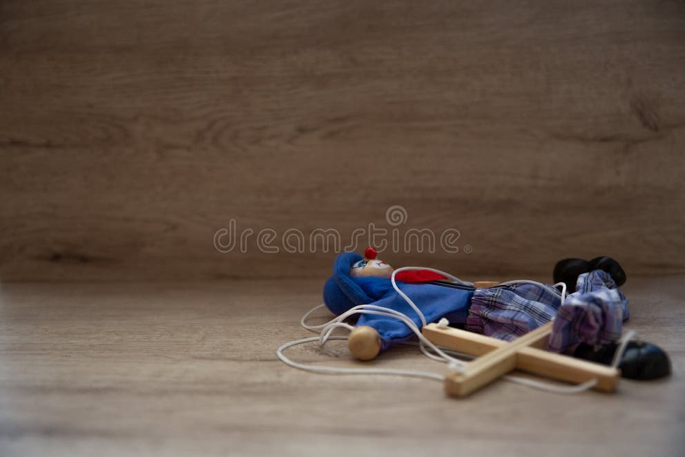 A Puppet-clown, Entangled in Threads and Lying Limp Stock Photo - Image ...