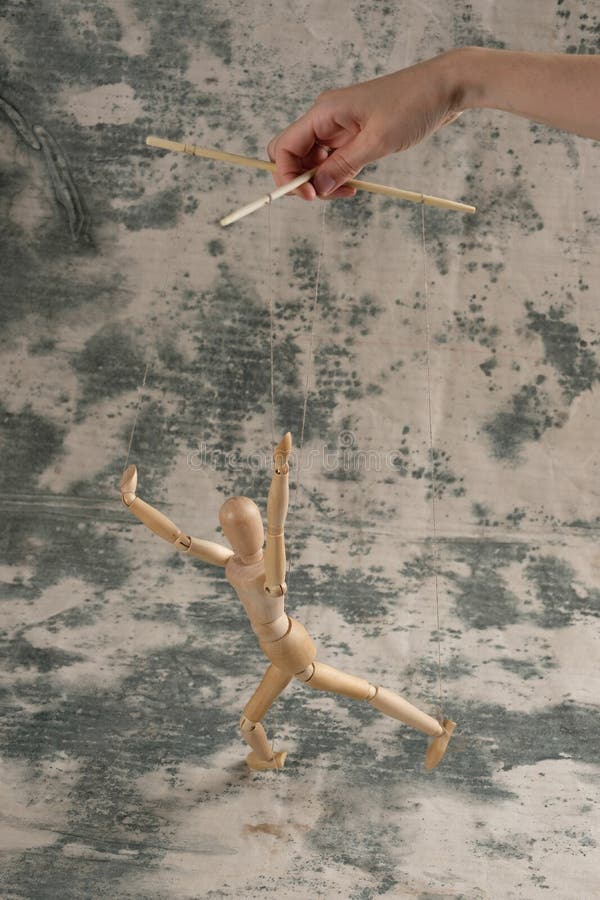 Puppet In The Hands Of Puppeteer Walks On Isolated, Background. The ...