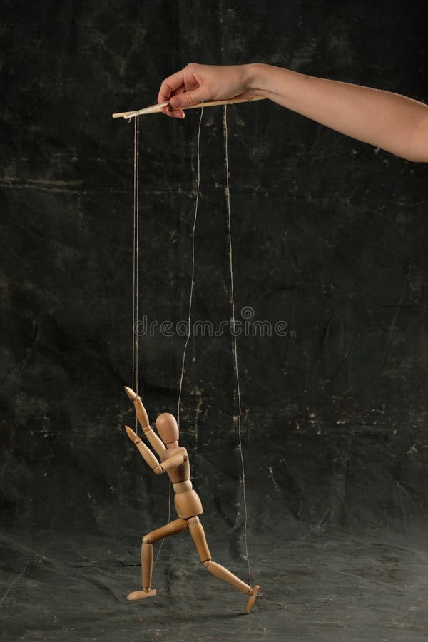 Puppet in the Hands of Puppeteer Walks on Isolated, Background. the ...