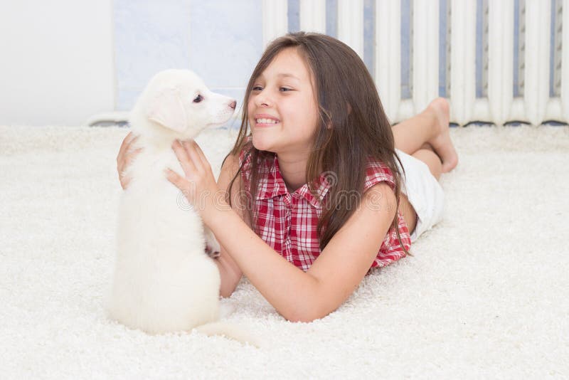 Puppy and girl stock image. Image of girl, embracing - 74506313