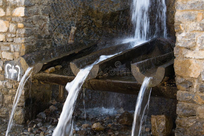 Pure Mineral Drinking Water Flowing from the Natural Mountain Source ...