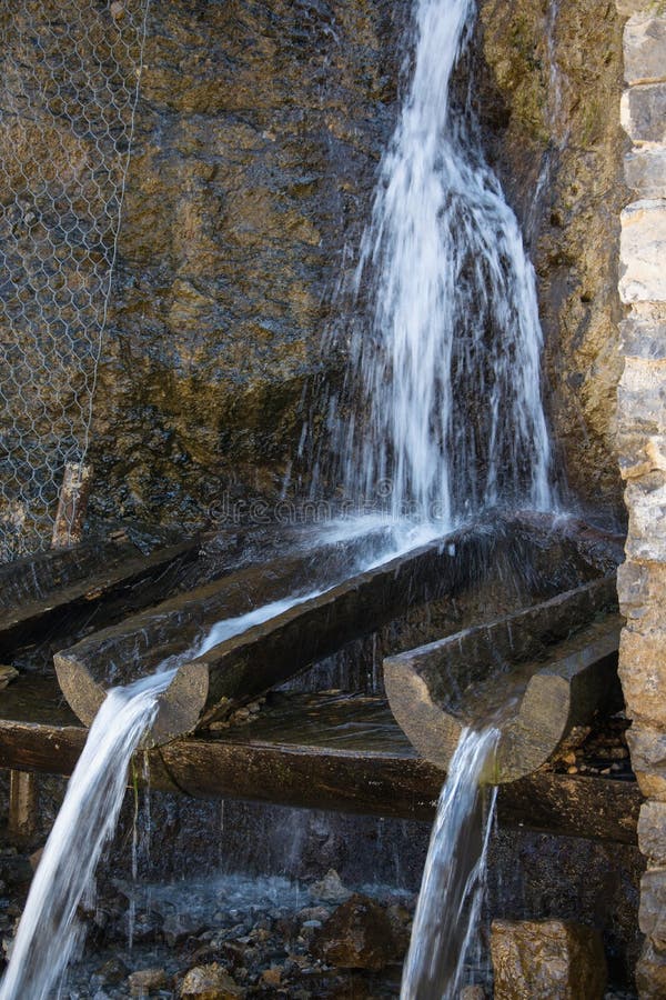 Pure Mineral Drinking Water Flowing from the Natural Mountain Source ...