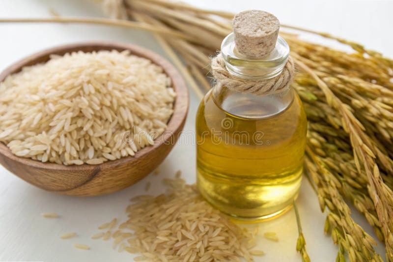 Pure Rice Bran Oil Extracted from Rice Bran on White Surface Stock ...