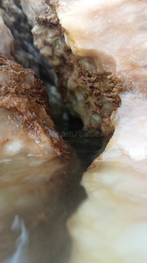 Water Flowing through a Broken White Rock Stock Image - Image of ...