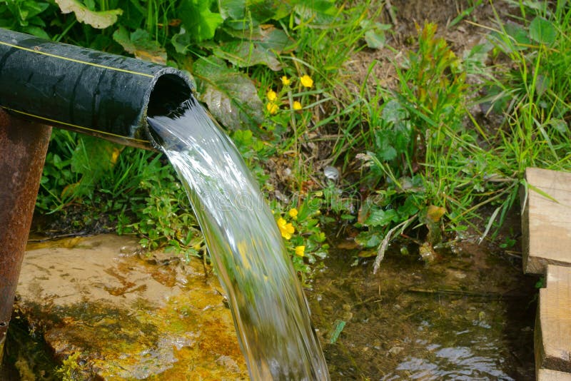 Pure Water Flows from the Pipe Stock Image - Image of steel, springtime ...