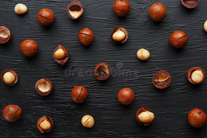 Purified and Shell Repeats Macadamia Nuts on Black Textural Stone ...